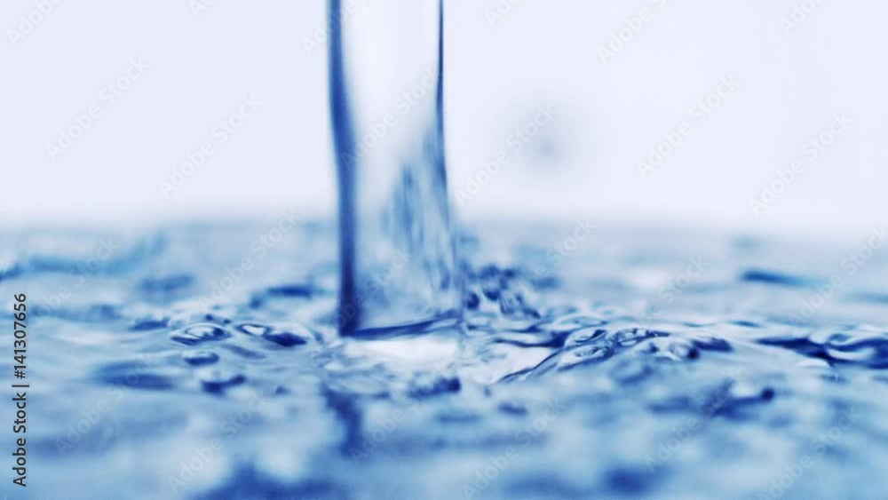 Pouring clear water to a plastic bottle Stock Video | Adobe Stock