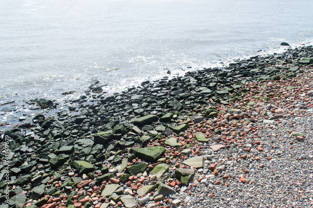 Pebbles water, river bed pebbles in clear blue water, winter scene ...