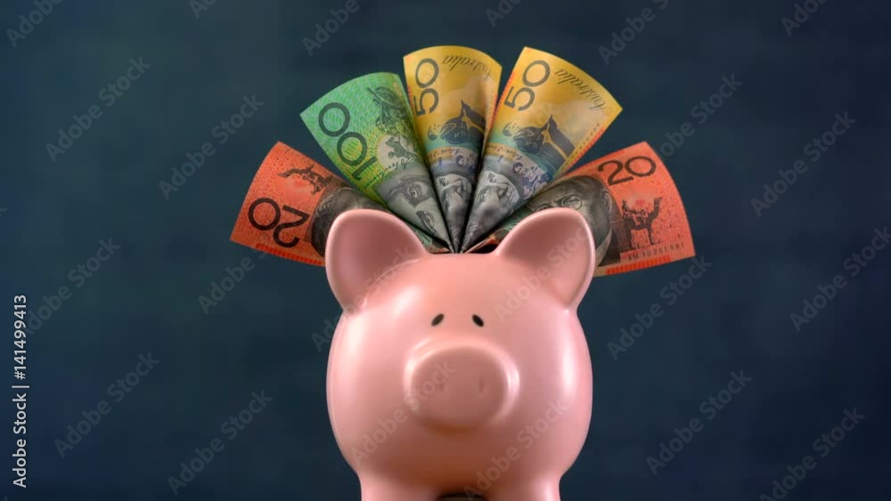Australian currency with pink piggy bank Stock Video | Adobe Stock