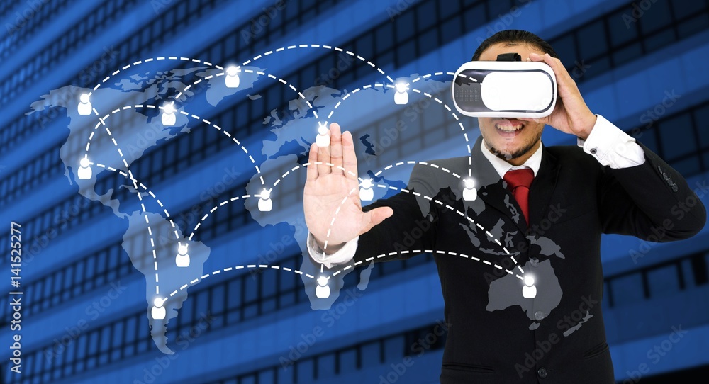 Young asian businessman wearing VR virtual reality headset, business ...