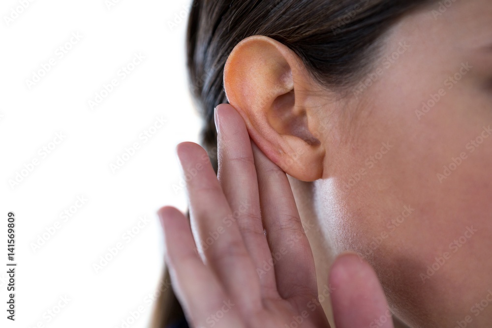 Businesswoman listening with hand on ear Stock Photo | Adobe Stock