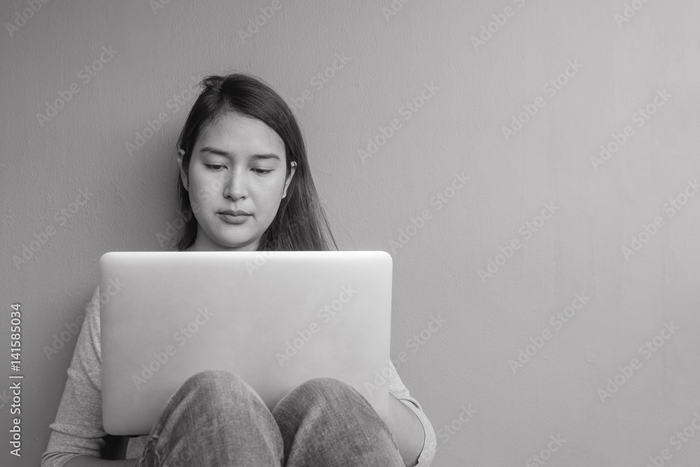 Closeup asian woman sitting for use computer notebook in work concept ...