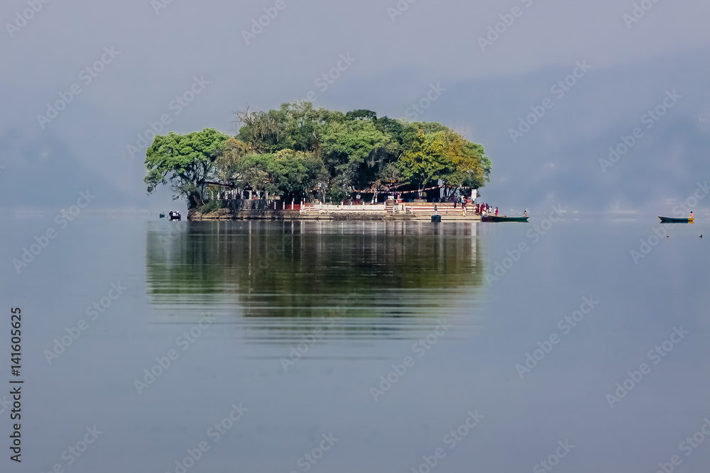 Tal Barahi Temple island in hazy Lake Phewa with reflections, Pokhara ...