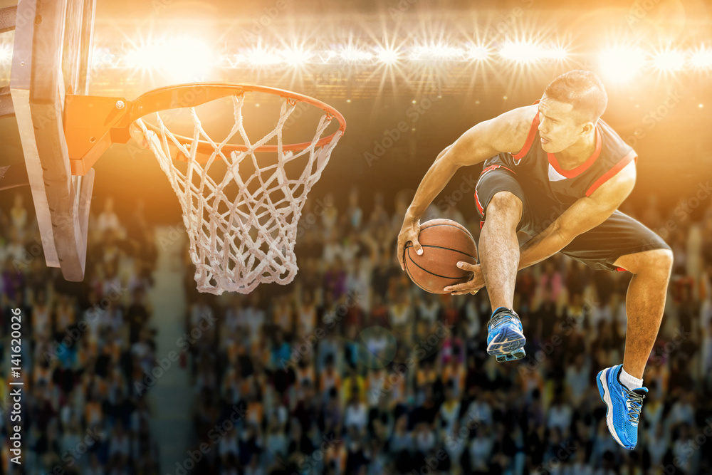 basketball player jumping and dribbling ball in the air,Action in the ...