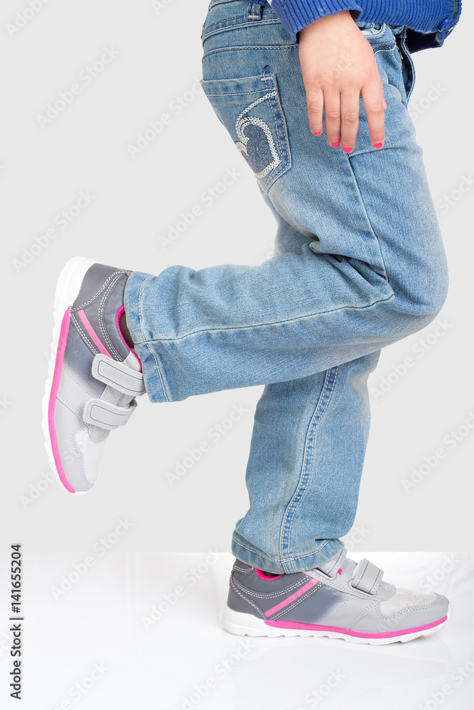 Young girl standing on one foot Stock Photo | Adobe Stock