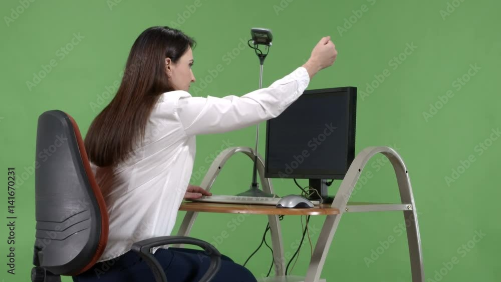 Stressed office worker smashing desktop computer with blue screen of ...