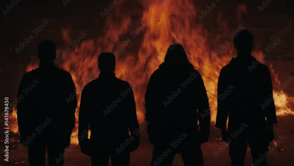 Four man silhouette standing on fire flames background. Silhouette men ...