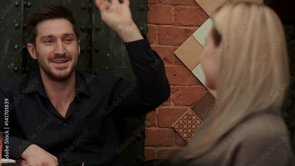 Friends chatting and laughing in the bar of restaurant Stock Video ...