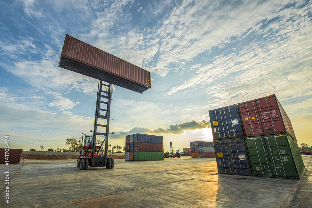 containers stacker forklift lifting-on unit of container in yard at ...