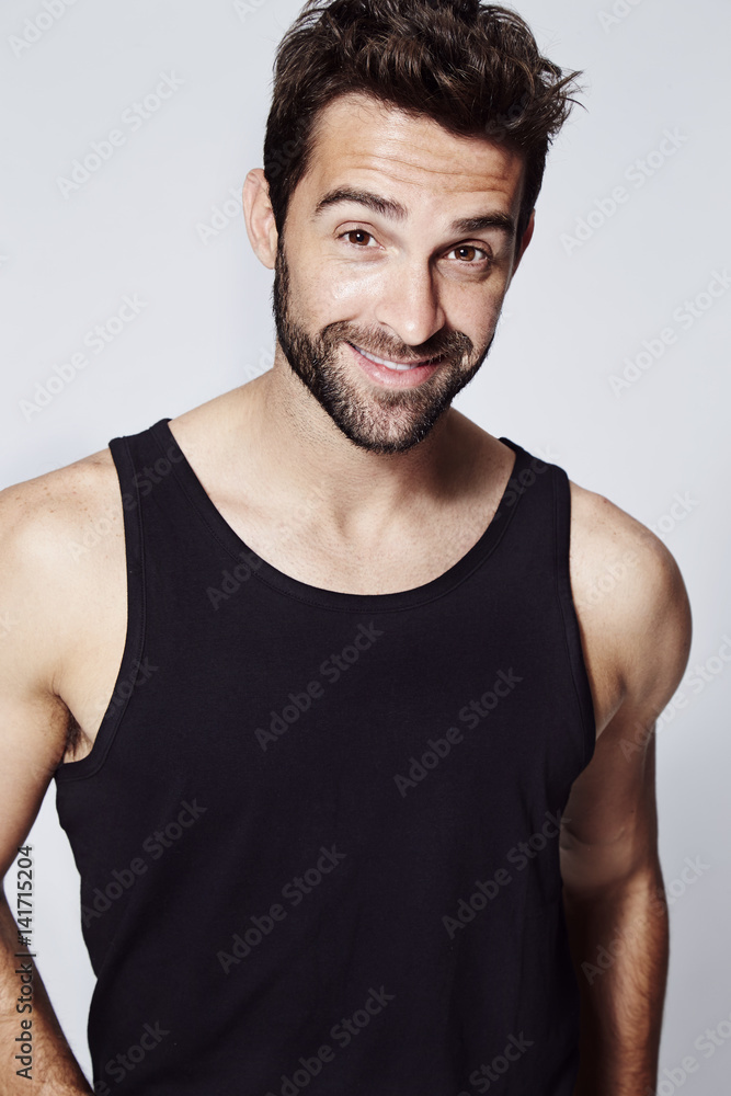 Bearded and buff guy in studio, portrait foto de Stock | Adobe Stock