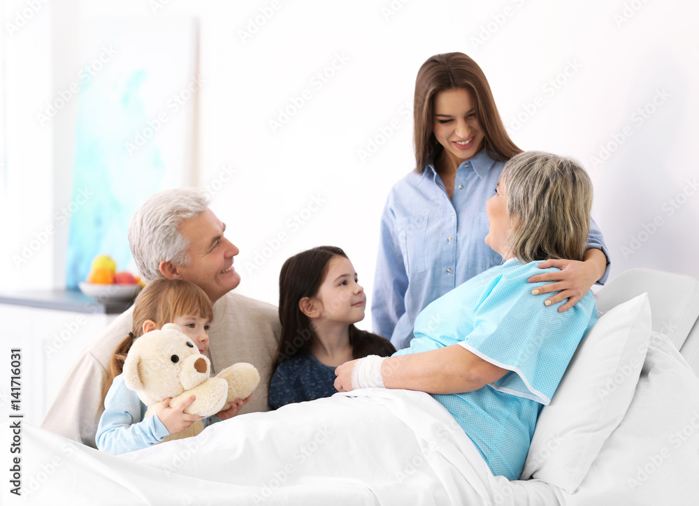 Family visiting grandmother in hospital Stock Photo | Adobe Stock