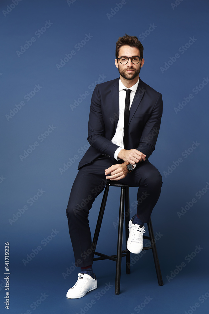 Portrait of smart man in suit, studio Stock Photo | Adobe Stock