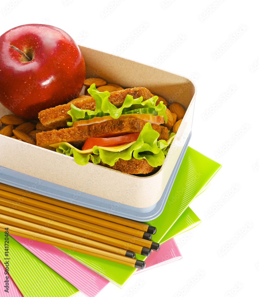 Lunch box with food and stationery on white background Photos | Adobe Stock