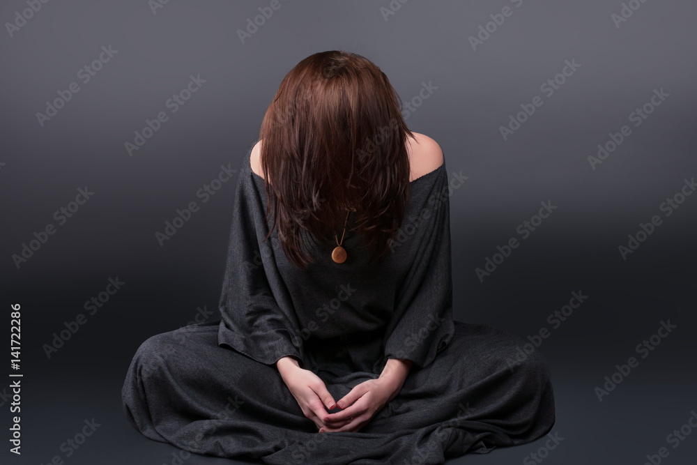 Portrait of a young caucasian woman praying. Prayer girl dressed in ...