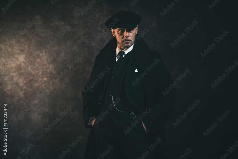 Retro 1920s english gangster. Peaky blinders style. Stock Photo | Adobe ...
