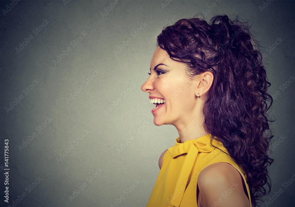 Side profile portrait of a happy laughing woman Stock Photo | Adobe Stock