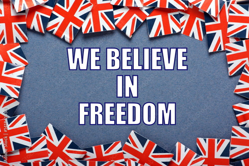 The words We Believe in Freedom surrounded by a border of flags of the ...