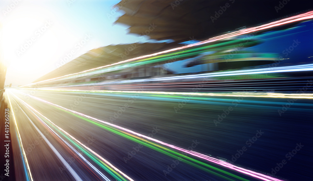 Foward motion speed lens blur racing circuit background with seated ...