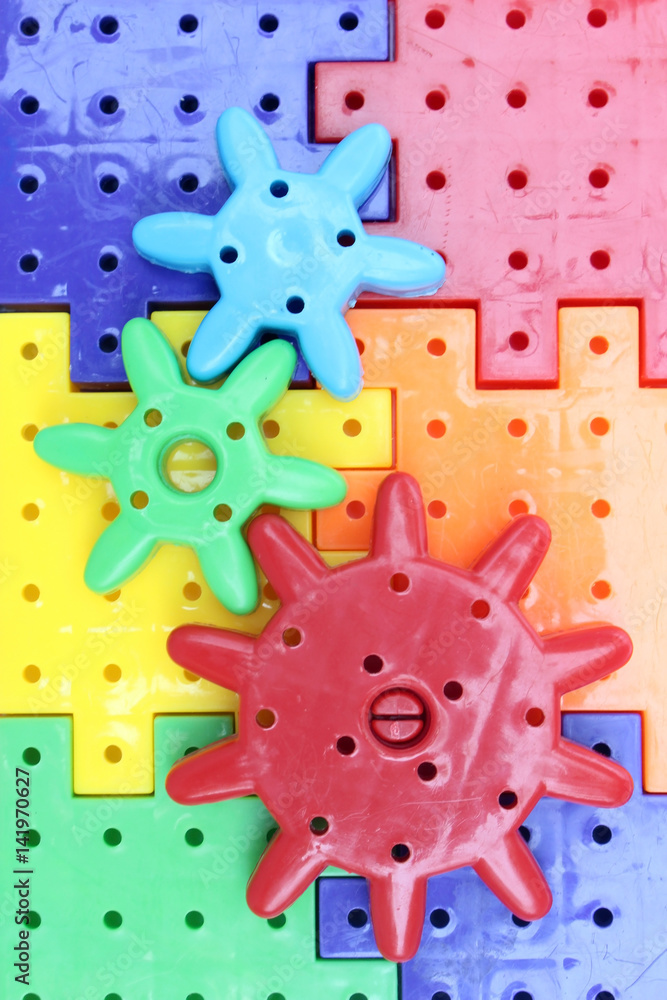 Colorful Plastic Cogs / Gears Stock Photo | Adobe Stock