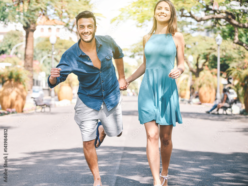 Couple Holding Hands Running