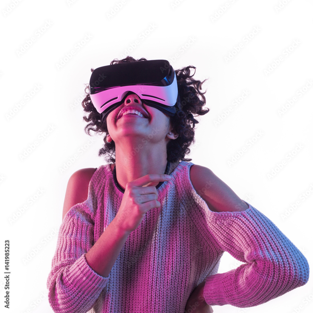 Foto de Young woman wearing VR helmet do Stock | Adobe Stock