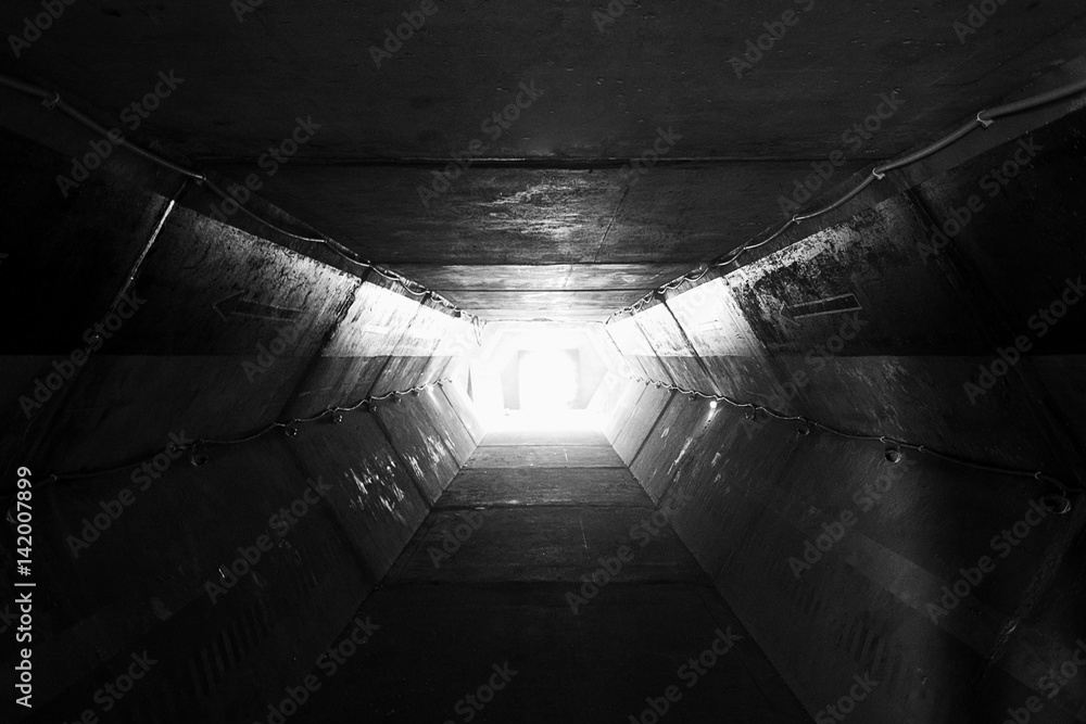 Light at the end of tunnel black and white,square concrete tunnel ...