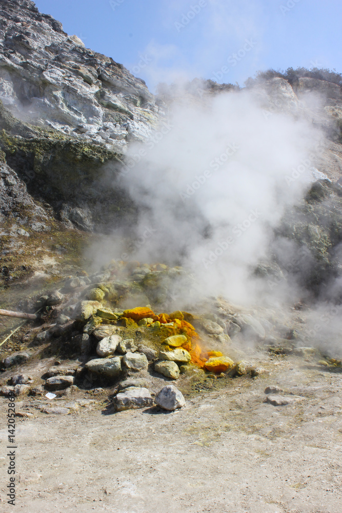 The Solfatara is a shallow volcanic crater with steam with sulfurous ...