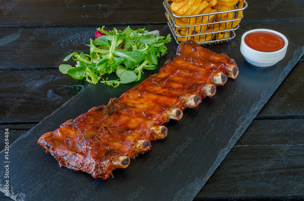 BBQ Ribs and Curly Fries Stock Photo | Adobe Stock