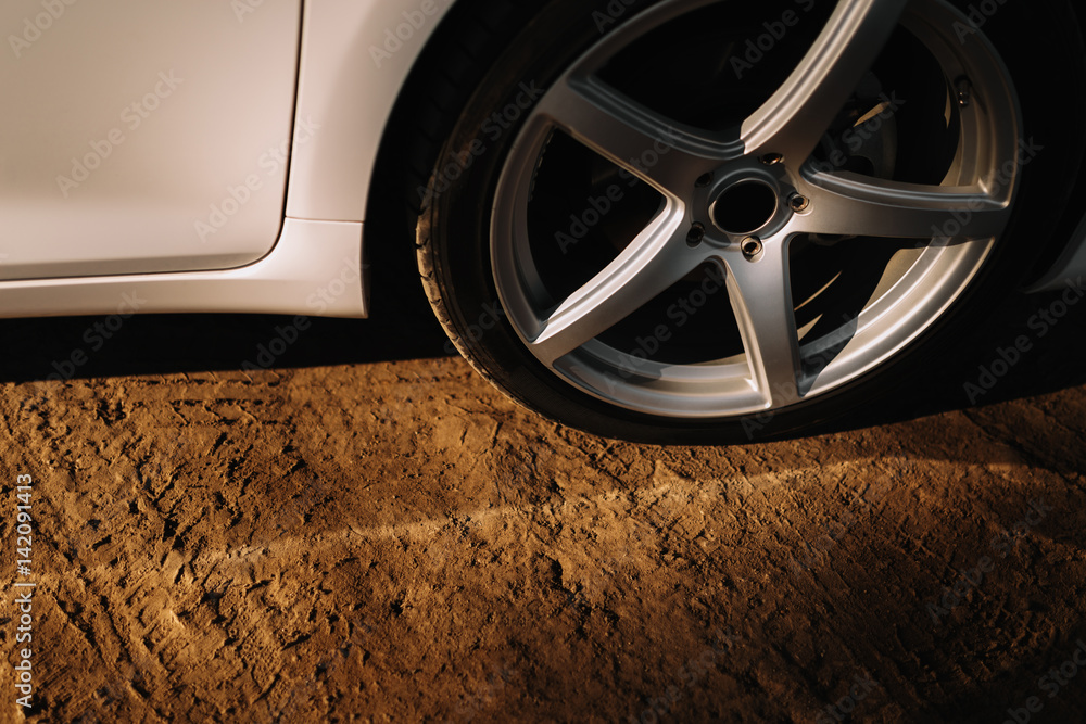 Modern rims on white car at sunset Stock Photo | Adobe Stock