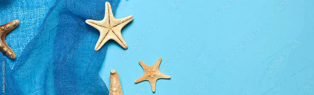 Marine blue background with seashells and starfish in fishing nets with ...