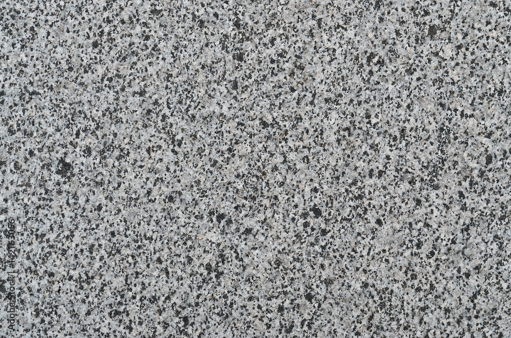 Monochromatic texture of granite surface. Detailed photo of the treated ...