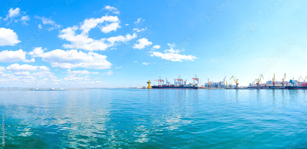 Panorama of the sea port. Cranes and ships. Bulk carrier ship in the ...