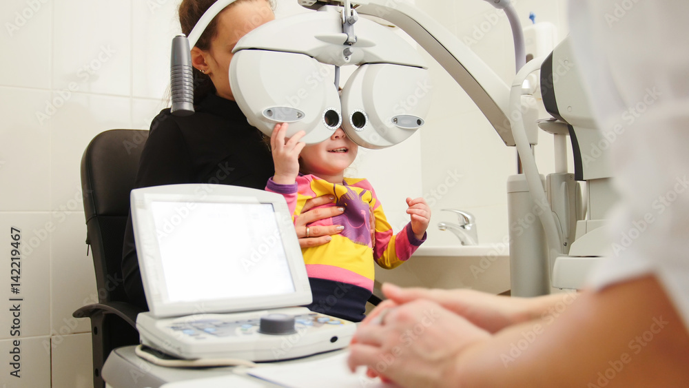 High technology in ophthalmology - optometrist in clinic checking ...