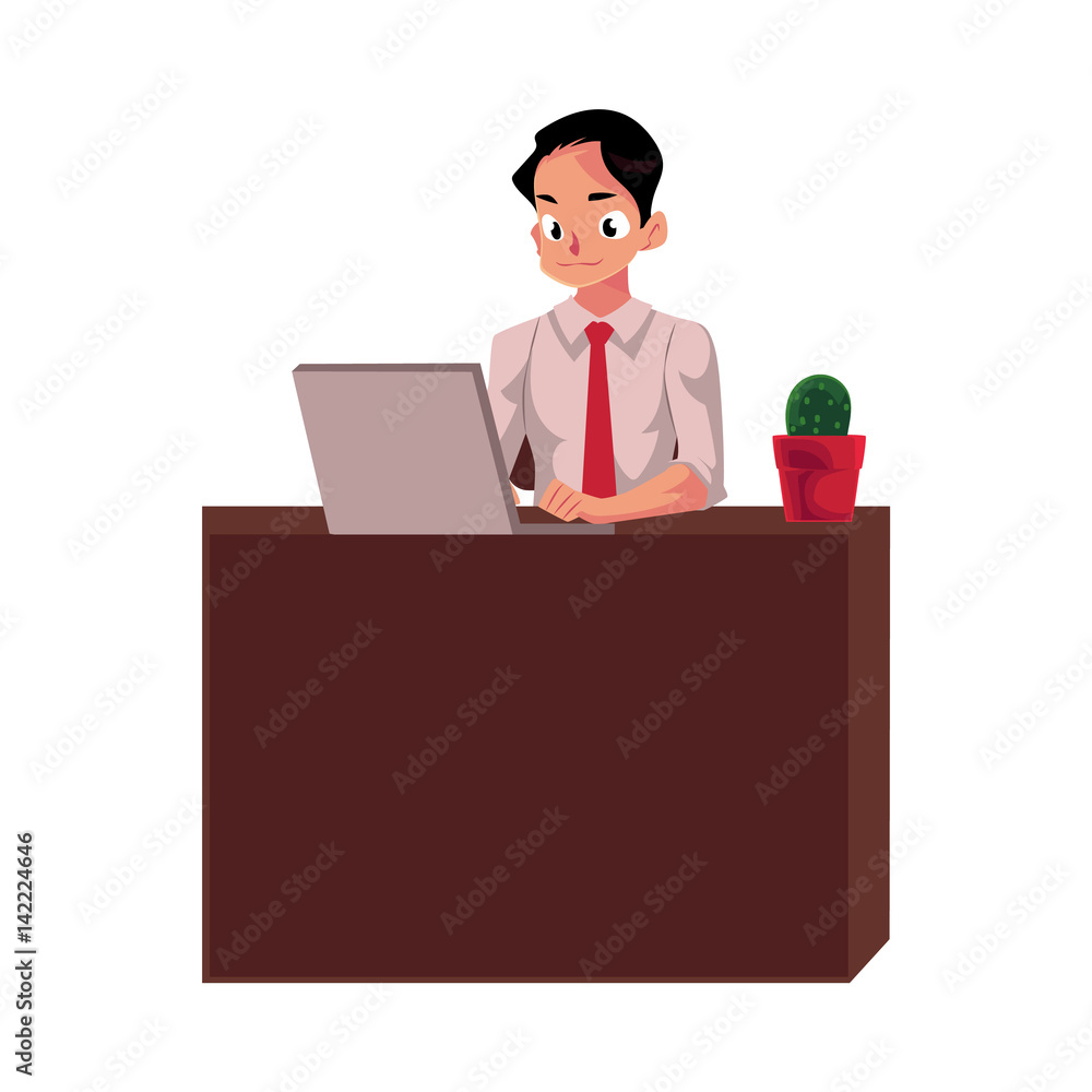 Young businessman working on computer, sitting at office desk, looking ...