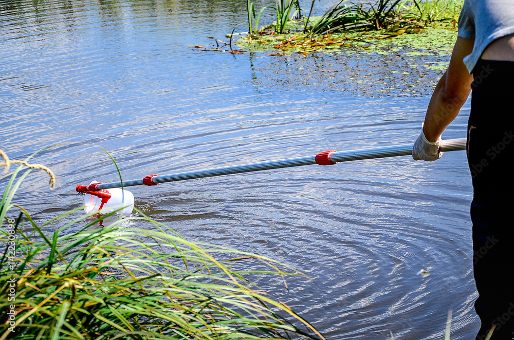 Take samples of water for laboratory testing. The concept - analysis of ...