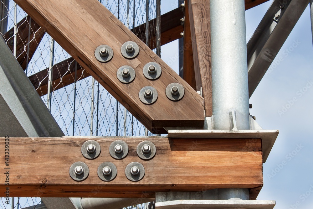 Foto de Wooden beams with screws in the structure. Assembling and ...