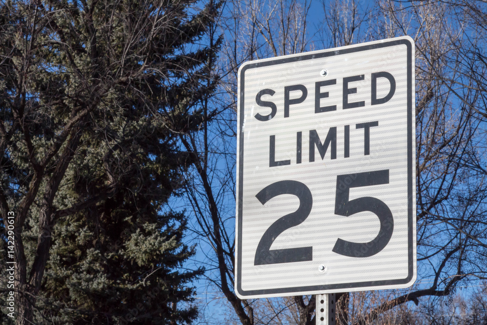 Speed limit 25 sign against trees Stock Photo | Adobe Stock