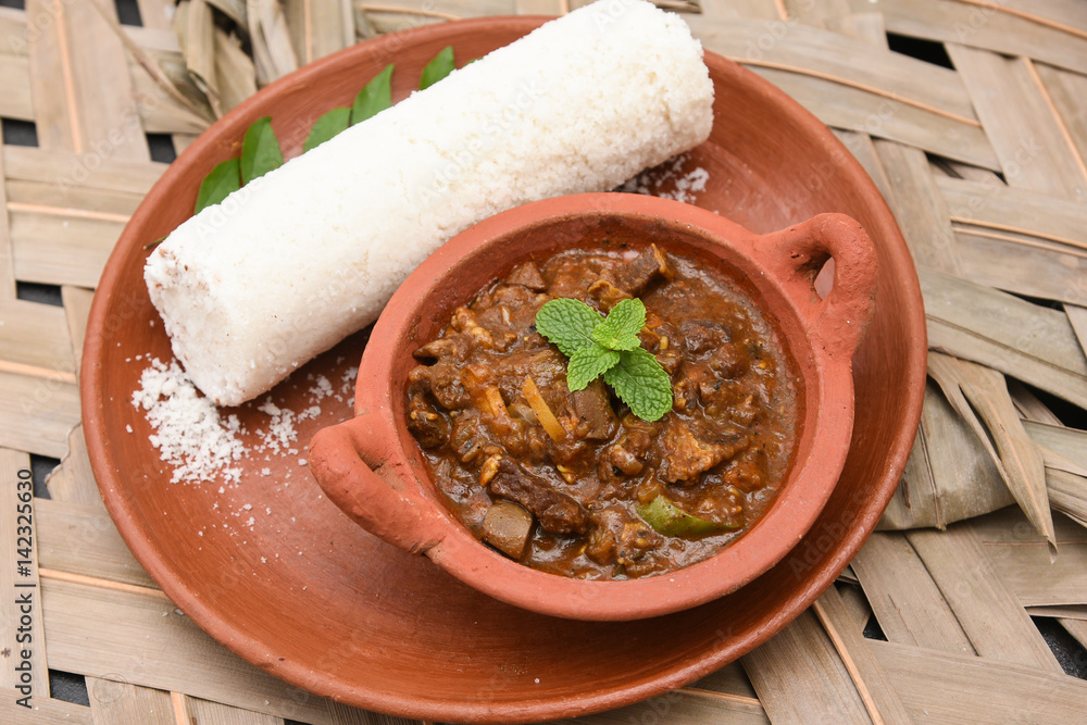 Rice Puttu or steamed rice cake with beef or mutton curry popular ...