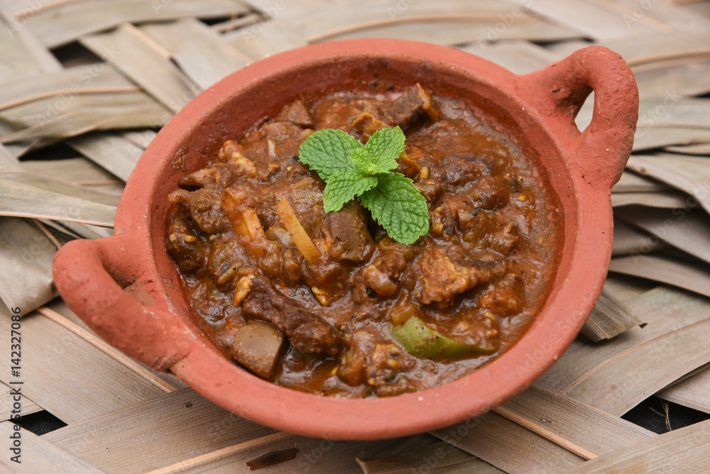 Top view hot and spicy beef curry Kerala, India. South Indian special ...