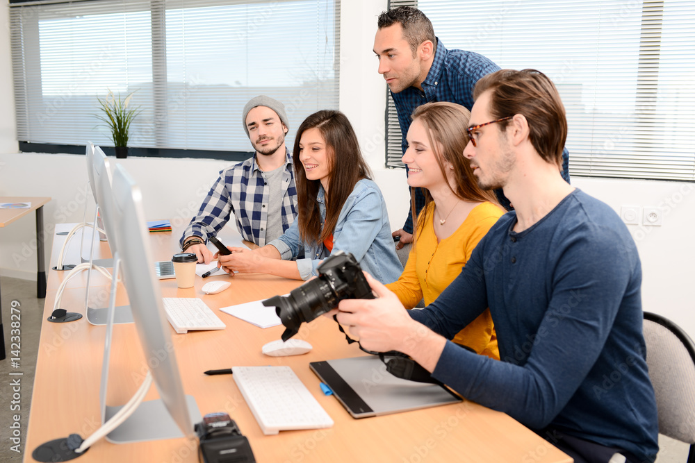 group of five young people student with their teacher in photography ...