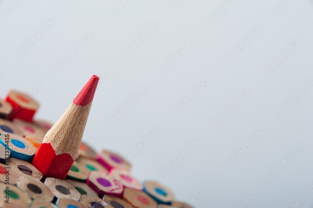 One red crayon on the background of pencils Stock Photo | Adobe Stock
