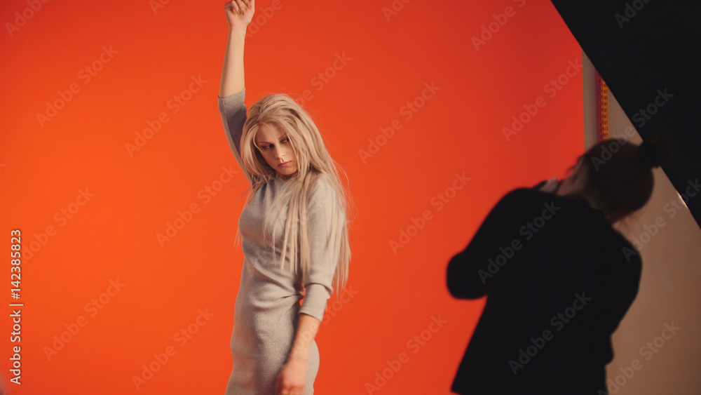 Fashion photo backstage: blonde model and photographer - photo session ...