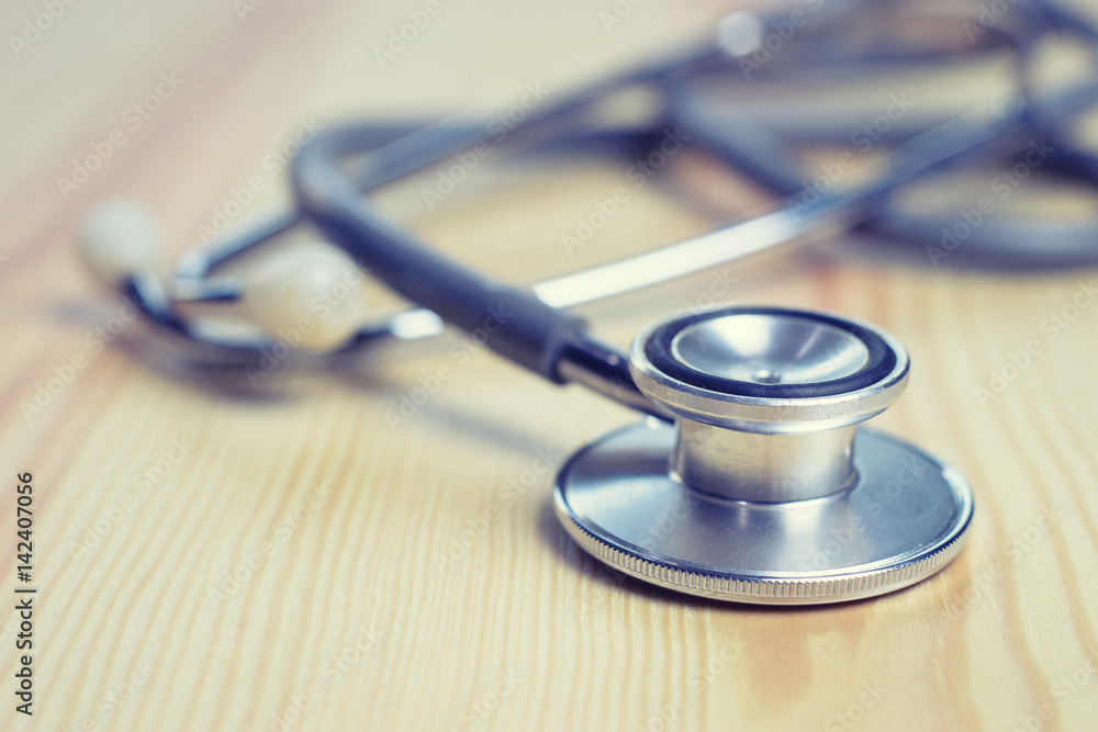 Stethoscope on wooden table,acoustic medical device for auscultation ...