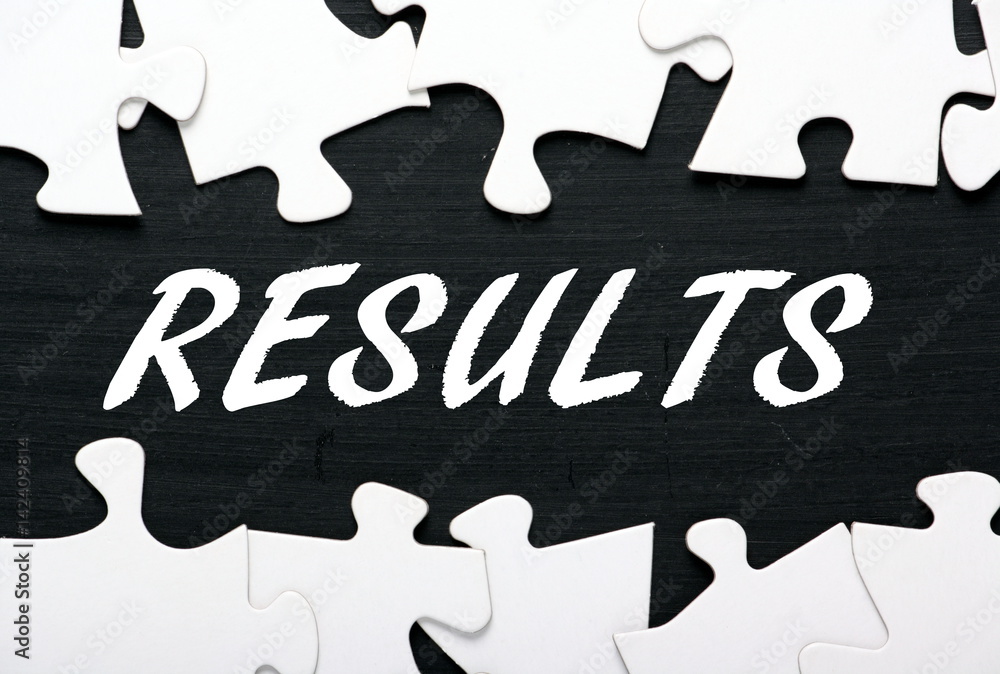 The word Results in white text on a blackboard with a border of jigsaw ...