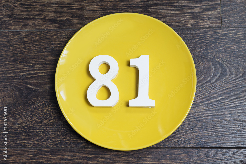 The number eighty-one on the yellow plate. Stock Photo | Adobe Stock