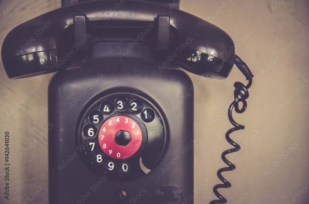Dialer and wood details of an old phone (telephone, phone, antique ...