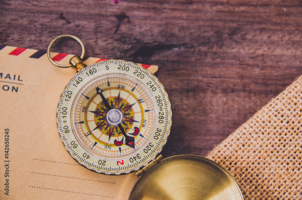 Vintage compass on the very old paper or letter envolop Stock Photo ...
