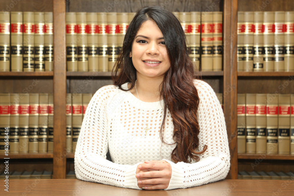 Young attractive female law student in law library Stock Photo | Adobe ...
