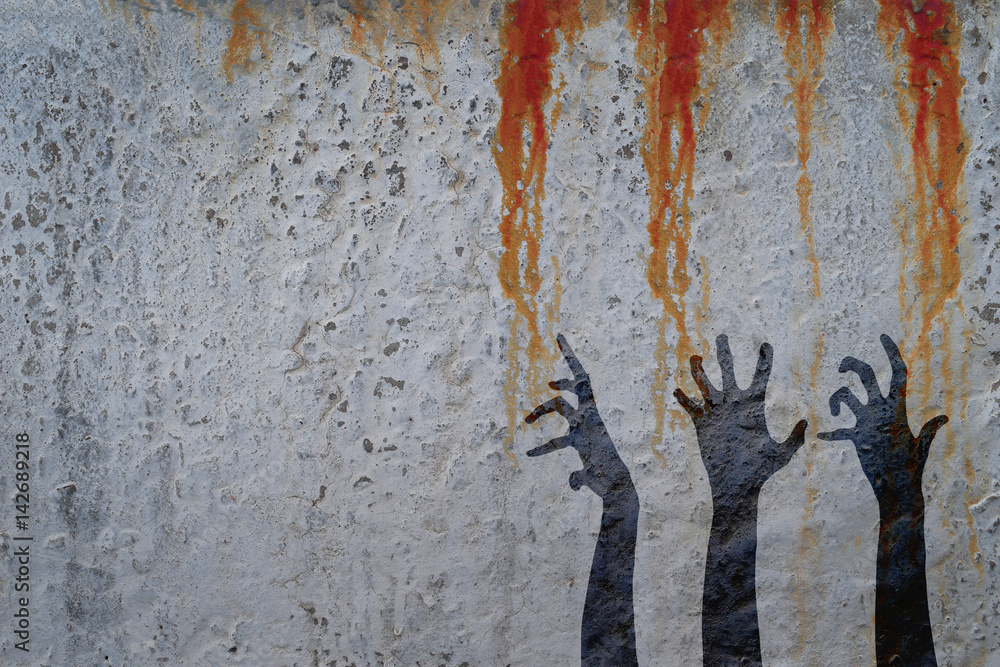 Zombie hands silhouette in shadow on concrete wall and blood background ...