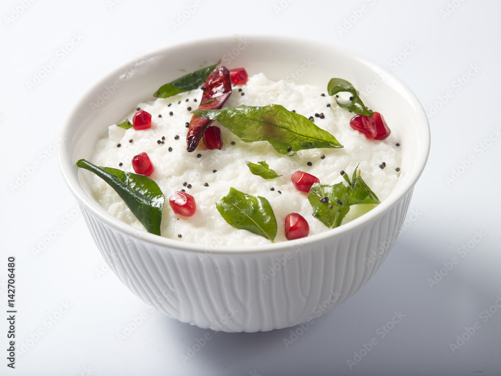 Curd rice served in a white bowl on white background Stock Photo ...